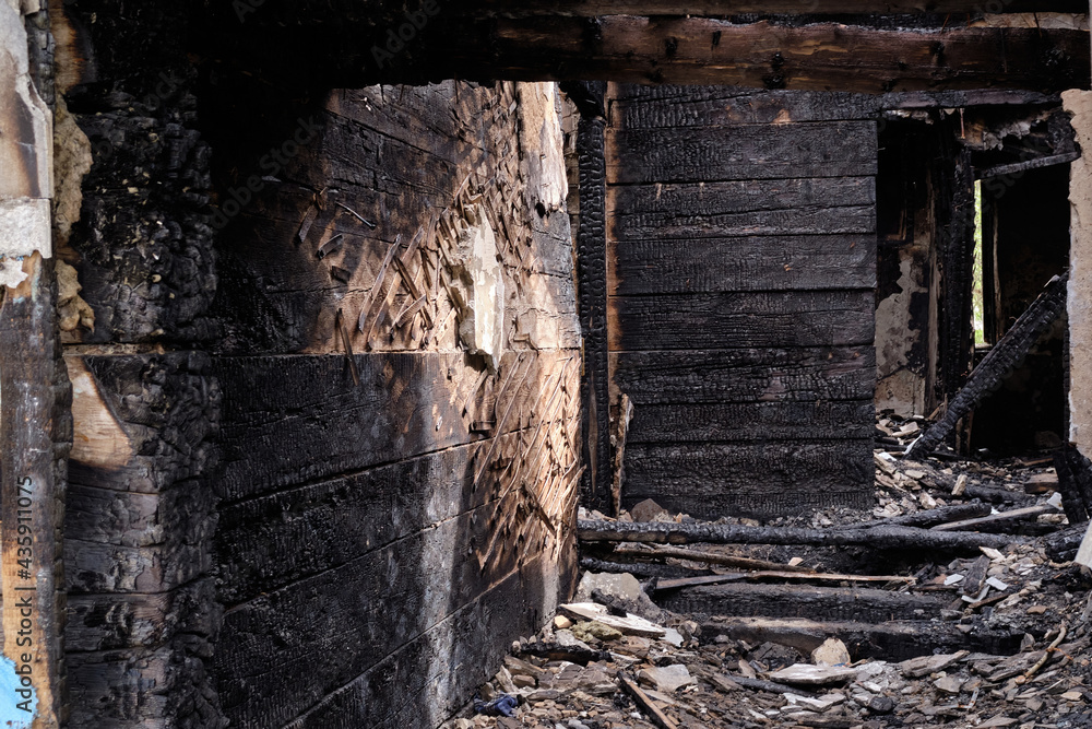 Dark burnt wooden house corridor after fire. Building after ...