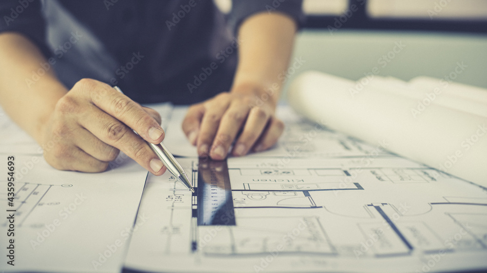Engineer and Architect concept, Man uses a ruler to measure the floor ...