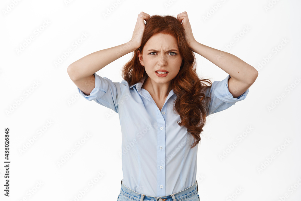 Frustrated and distressed redhead woman have problem, holding hands on ...