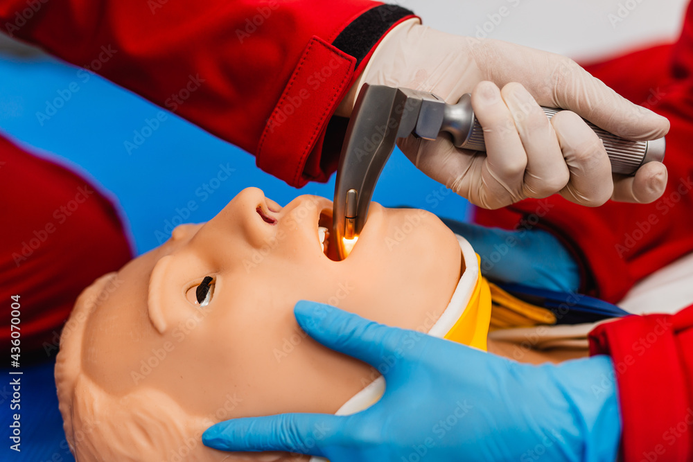 Endotracheal intubation of a reanimation training doll. First aid Stock ...