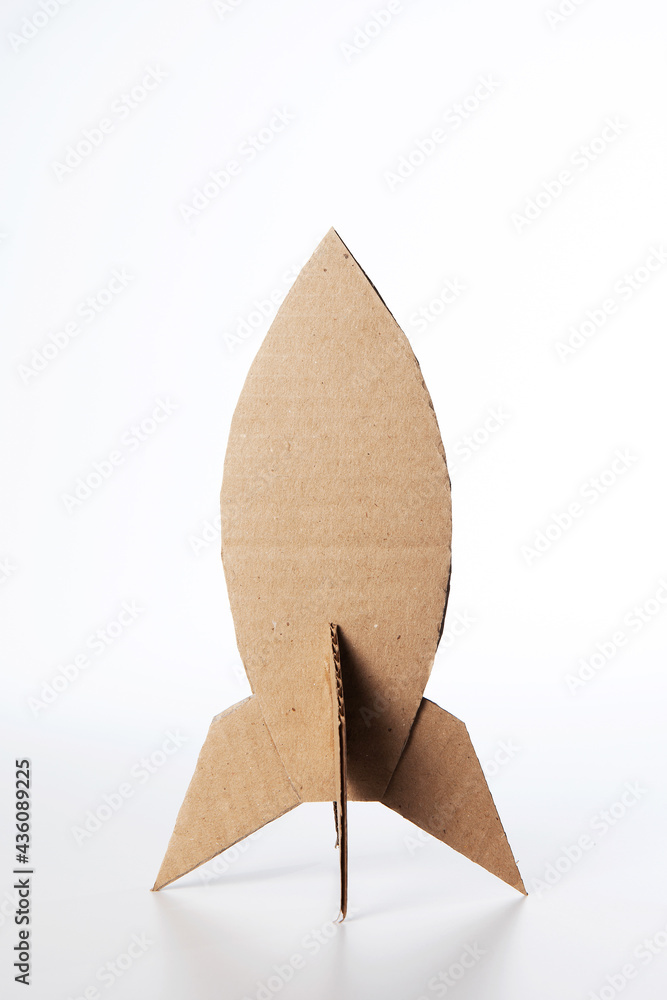 Rocket made of cardboard on a white background. Children art project ...