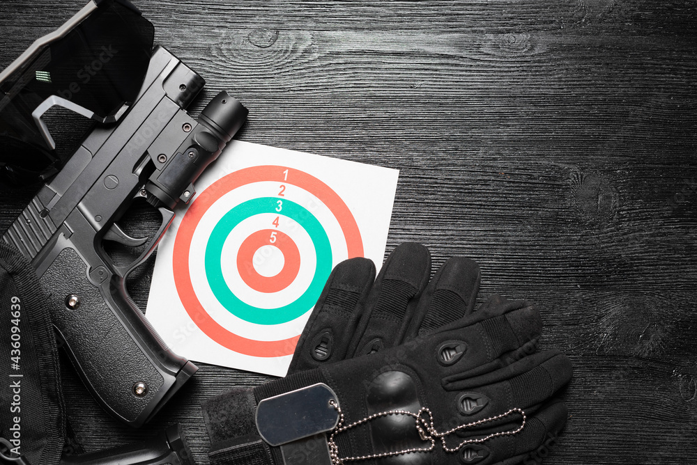 Gun and paper target. Shooting range concept. Shooting practice ...