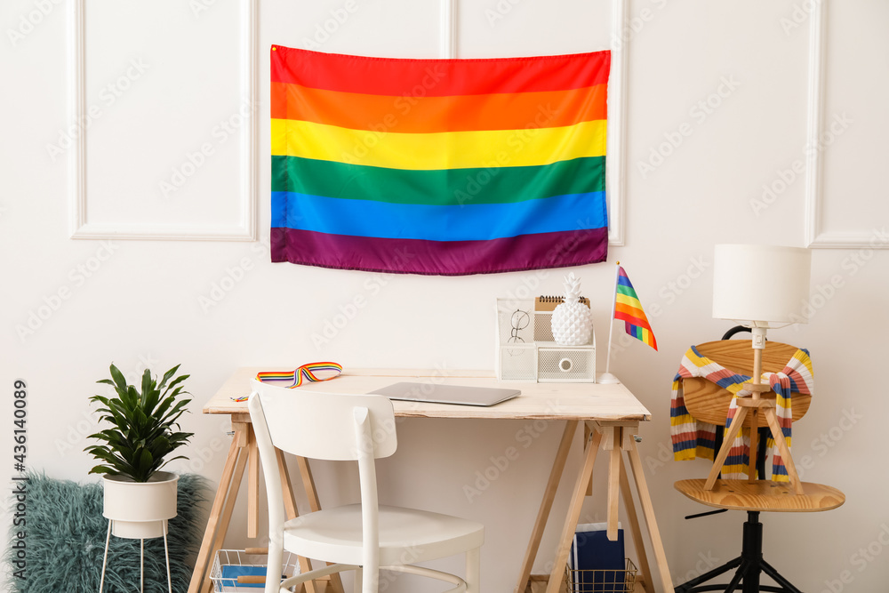 Modern workplace with flags of LGBT in room Stock Photo | Adobe Stock