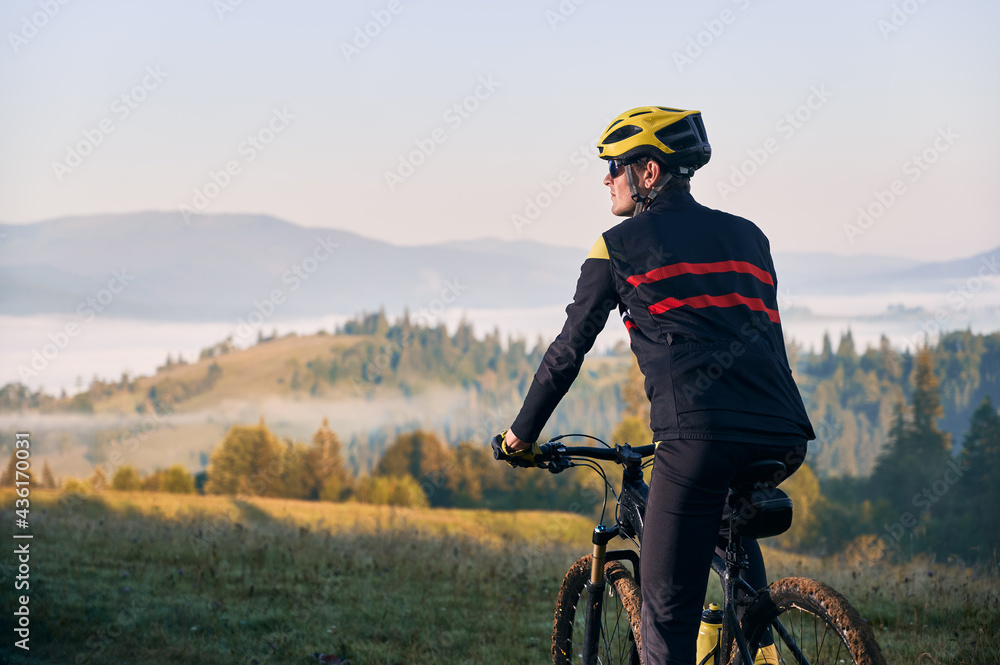 Man In Suit Riding Bicycle
