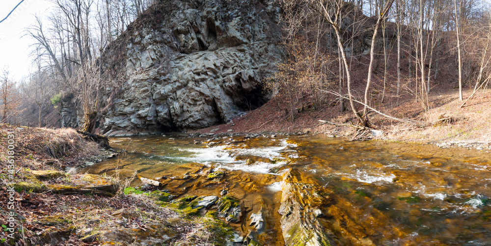 The Czarny Potok stream flowing next to the cave in Rosolina, Polana ...