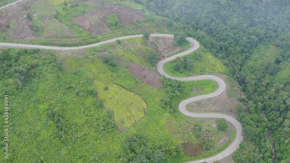 Aerial view of cars driving on curved, zigzag curve road or street on ...