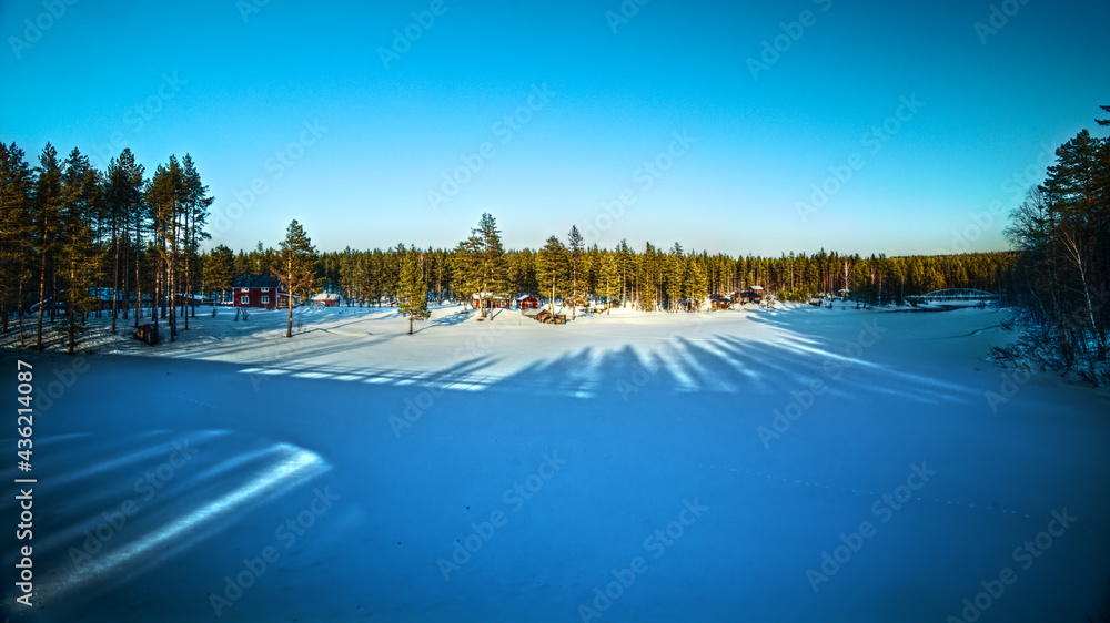 Long shadows on Mala River in Swedish Lapland Stock Photo | Adobe Stock