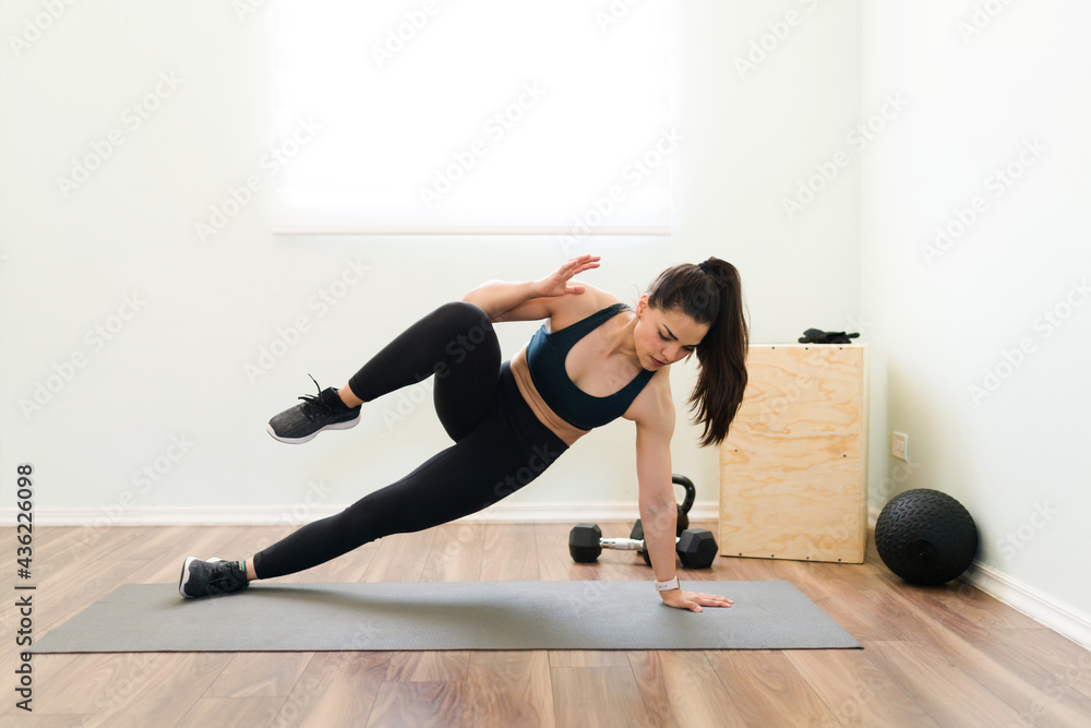 Practicing a high-intensity interval training at home Stock Photo ...