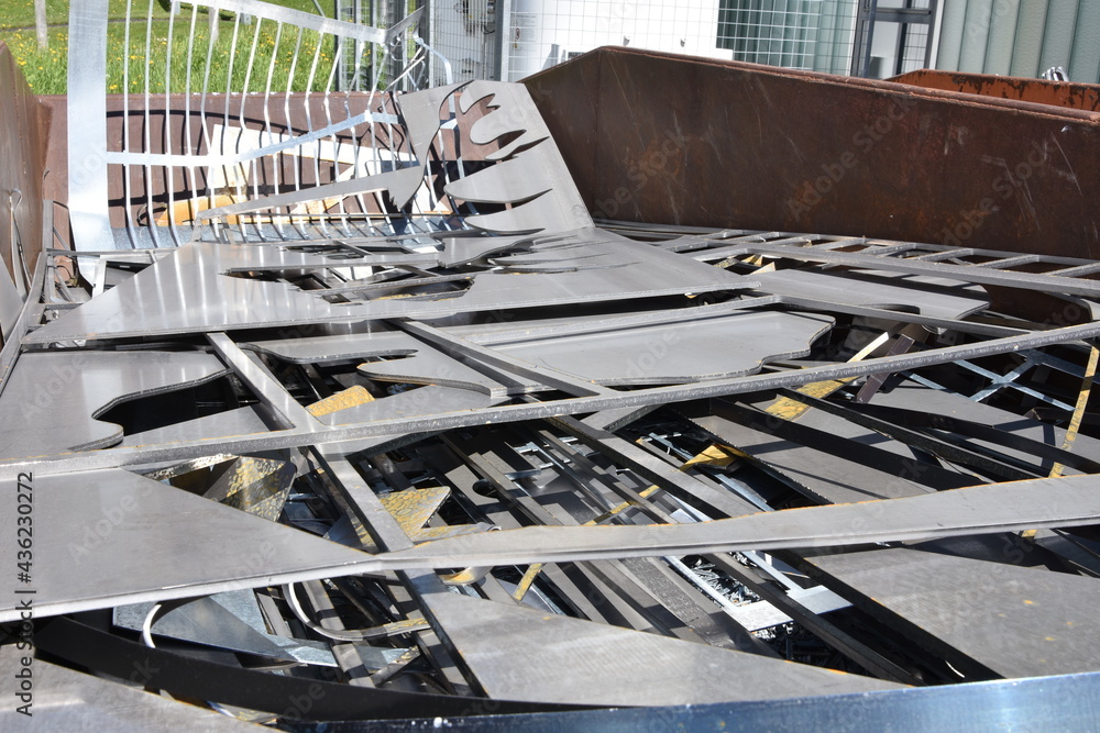 Metal plates as waste collected in a container in a community disposal ...