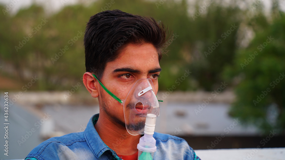 Asian Man infected with Covid 19 disease. Indian Patient breathing ...