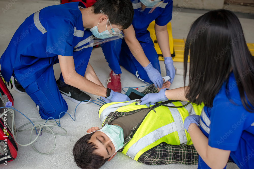 Emergency medical teams are helping unconscious patients using ...