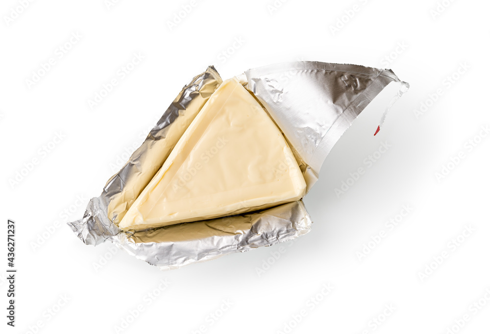 Foil wrapped processed creame cheese slice isolated on a white ...