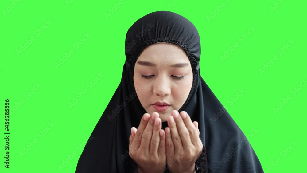 50p frame rate footage of Young Muslim women praying for the blessing ...