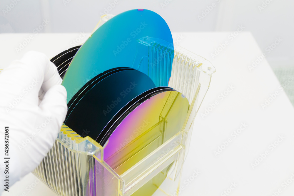 Silicon Wafers in plastic storage box in clear room of semiconductor ...