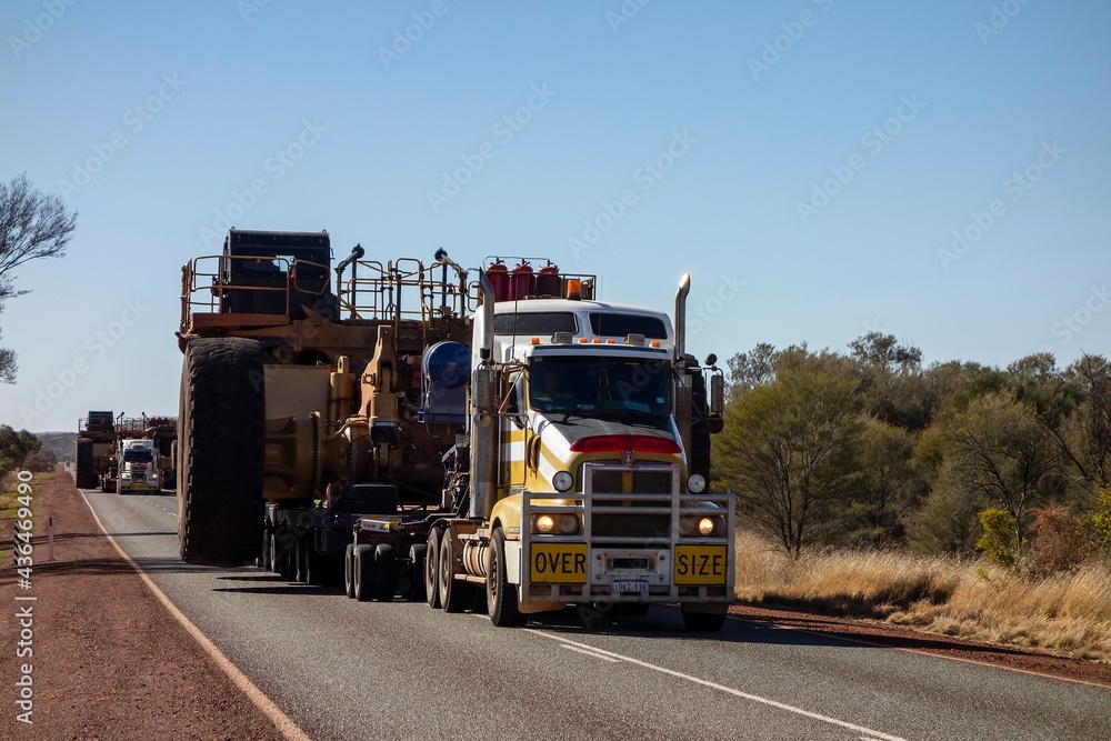 Kenworth heavy truck transporting extremely heavy oversize load on the ...