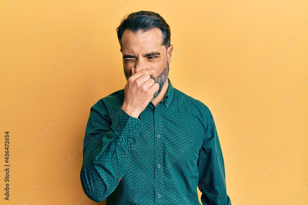 Middle age man with beard and grey hair wearing business clothes ...