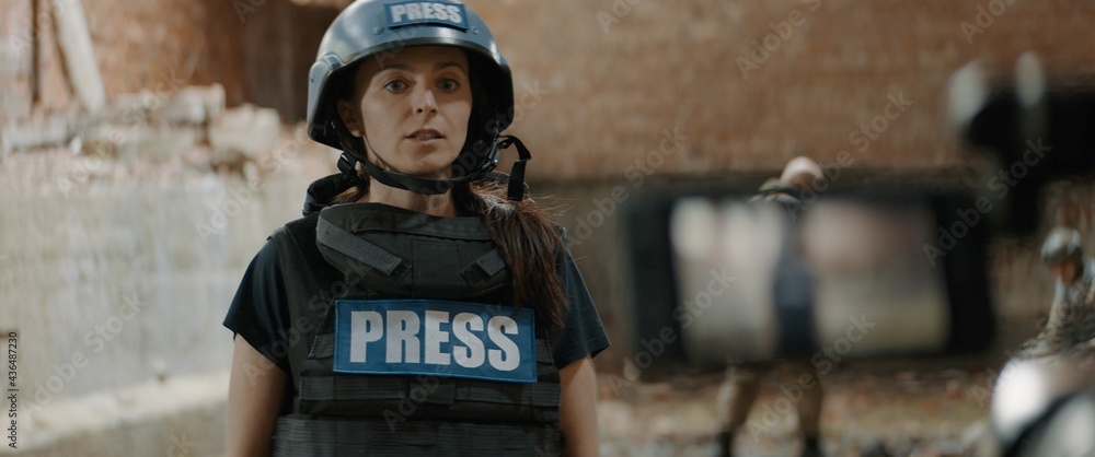 Behind the scenes of female war journalist correspondent wearing ...