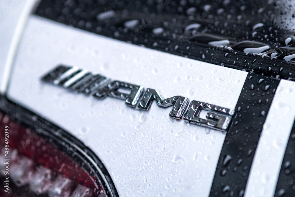 Hamburg, Germany - March 28, 2021: AMG badge on a white car. AMG is the ...