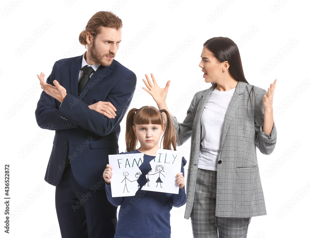 Little girl with torn picture of family and her quarreling parents on ...