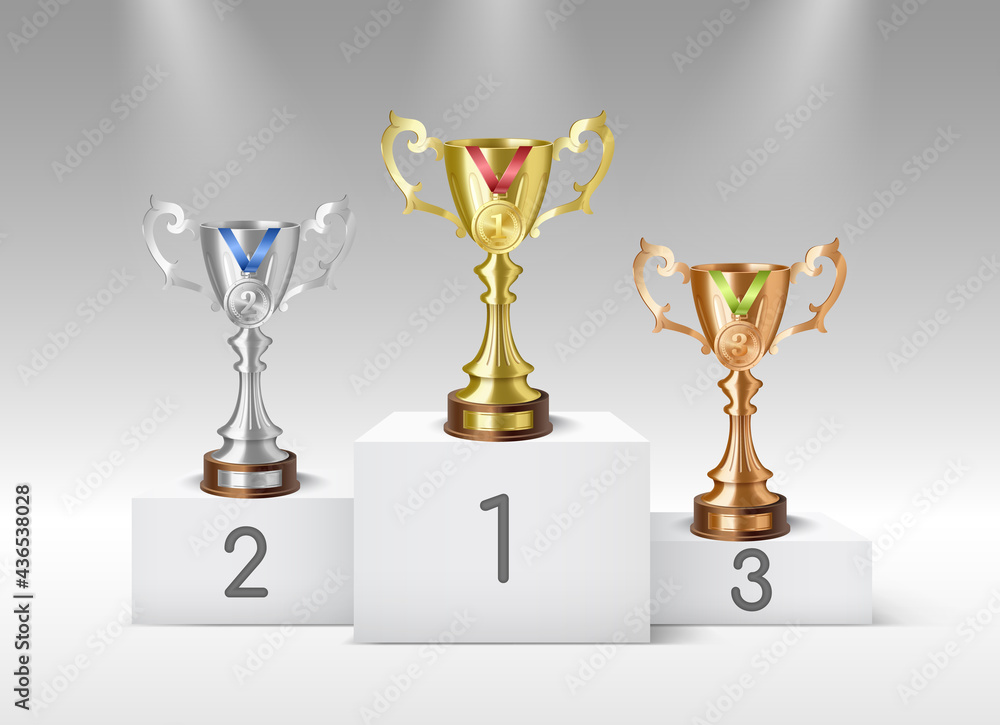 Golden silver bronze trophy cups on award podium. Realistic first ...