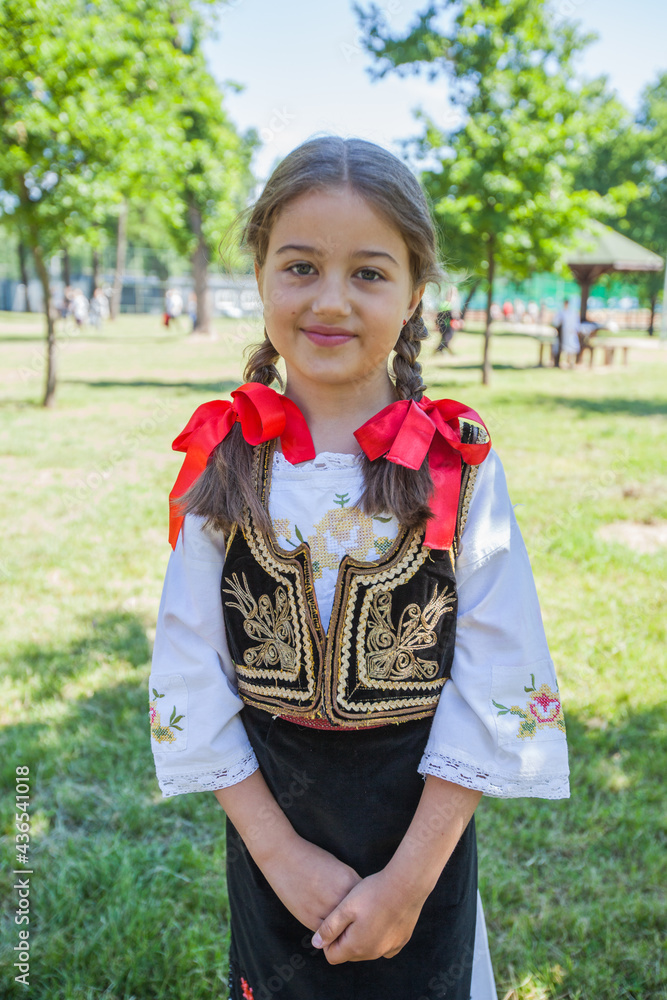 Serbian folklore, smiling cute little girl in traditional Serbian ...
