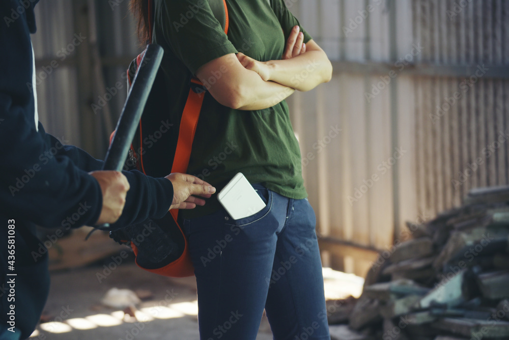 Thief armed man rob woman by baton on street stalker behind young woman ...