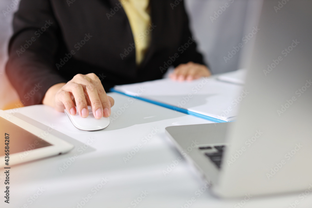 Businesswoman hands in black suit sitting and using mouse. Active woman ...