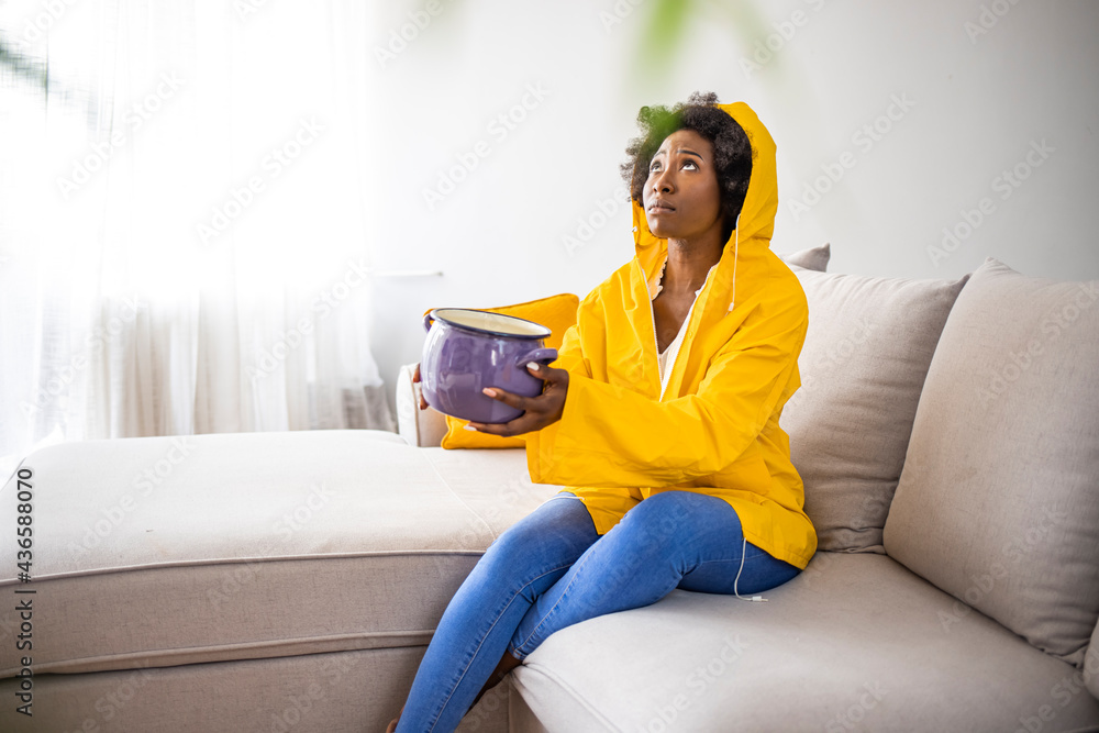 House Ceiling is Flowing - Woman Holding Bucket While Water Droplets ...