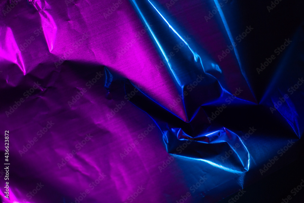 abstract iridescent dark metallic texture with vibrant neon colors ...
