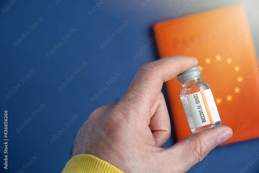hand with ampoule Vaccine concept with passport, syringe international ...