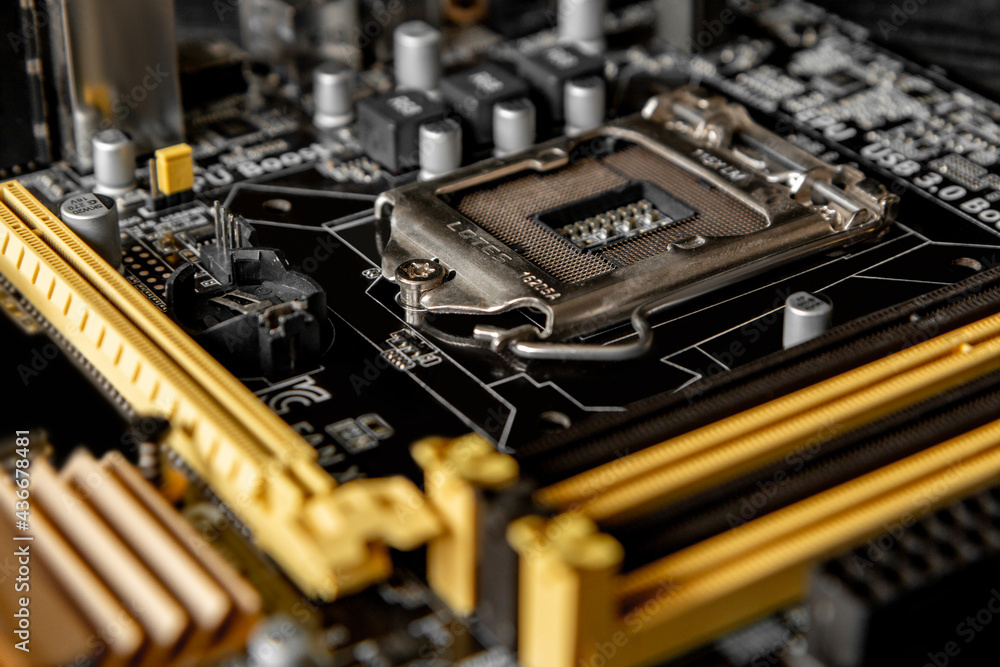 Part of the motherboard with a processor socket and other connectors to ...