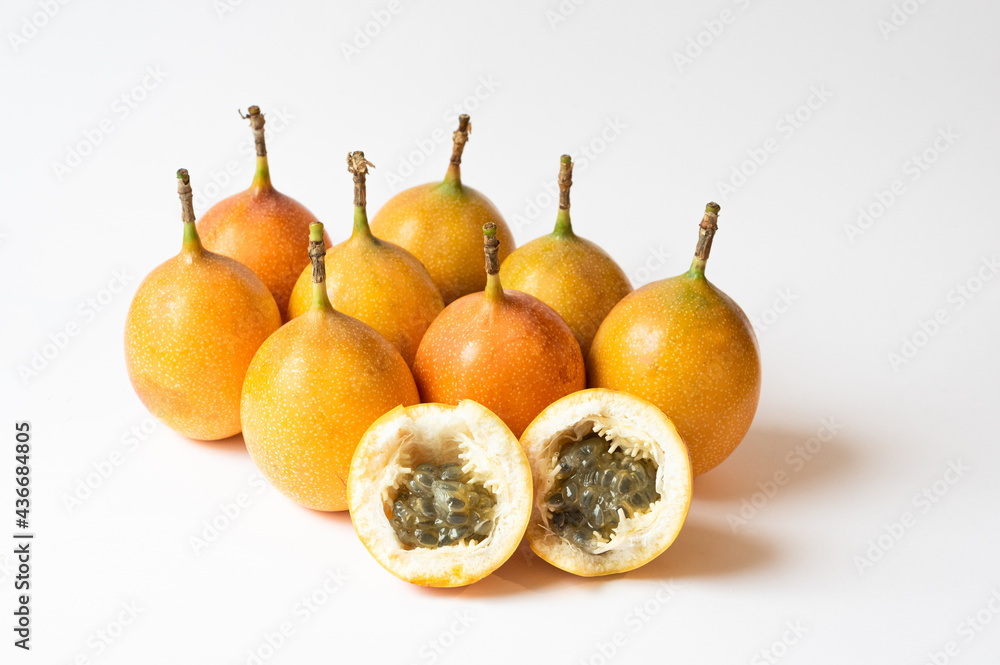 Granadilla or yellow passion fruit isolated on white background ...
