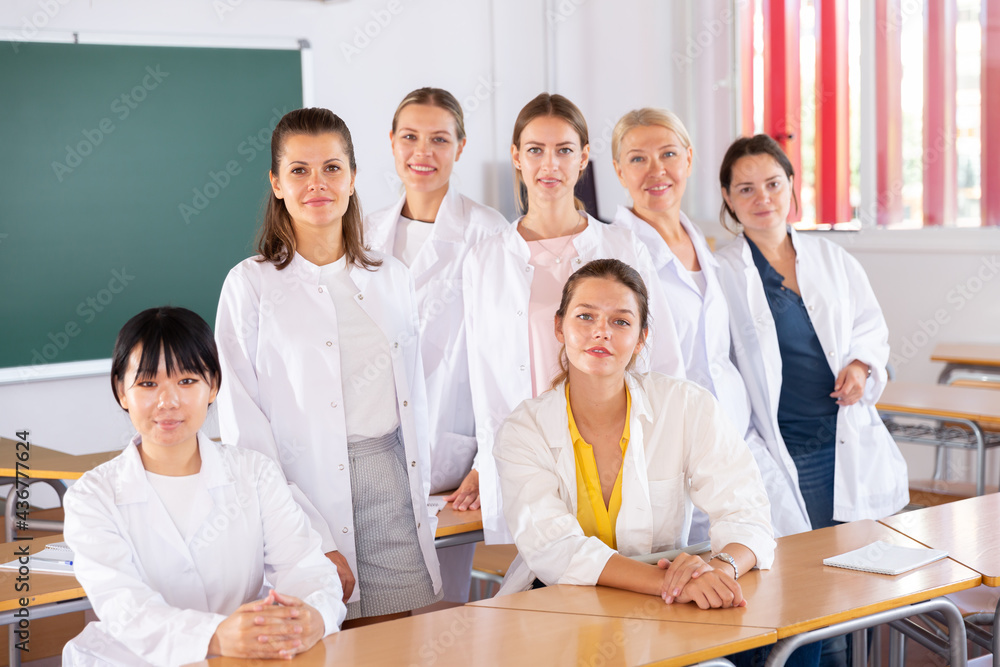Group portrait of cheerful multinational group of medical students with ...