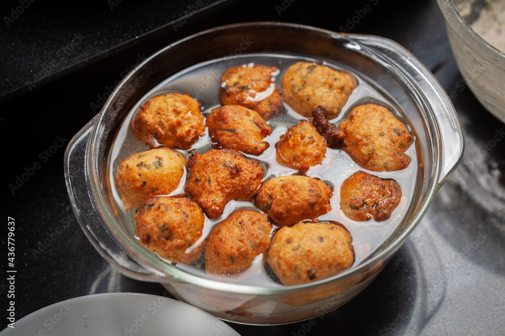 Plain dry dahi badhe for preparation of chaat, shocking in water after ...