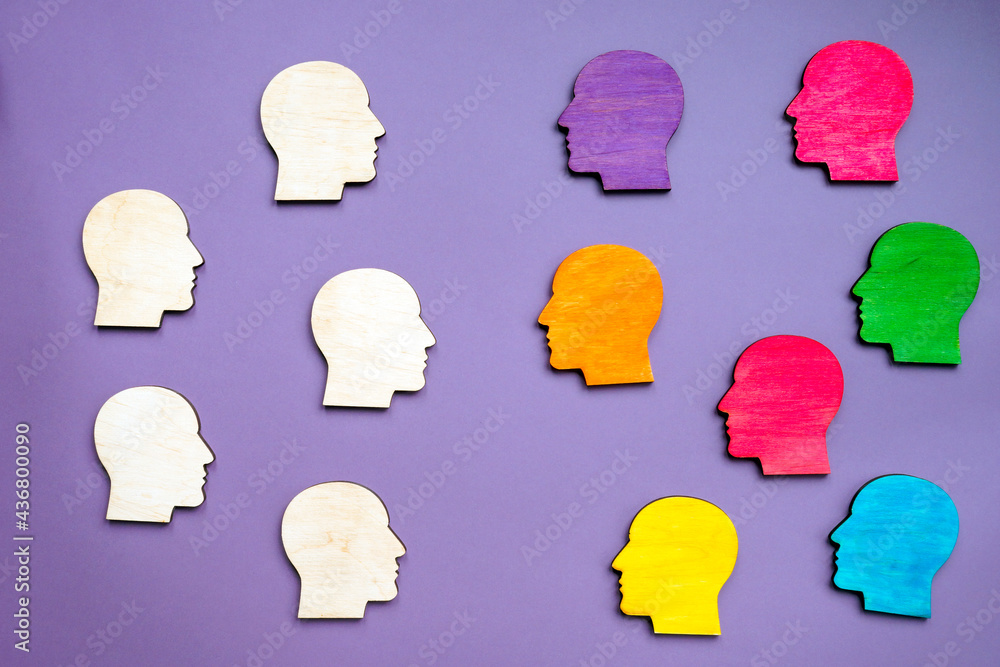 Colorful wooden heads as symbol of diversity, segregation and racism ...