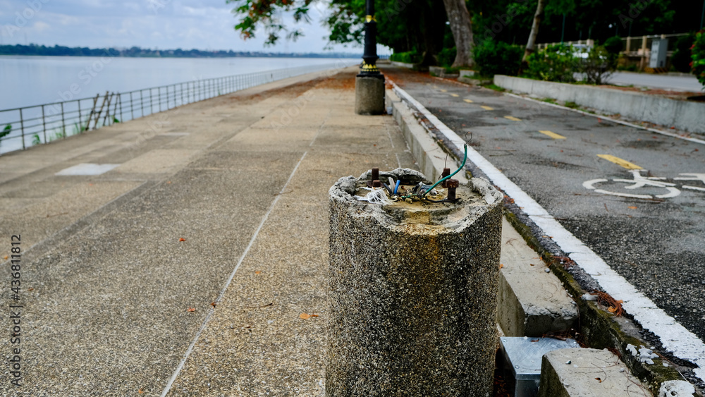 The concrete base of the light pole was damaged. Stock Photo | Adobe Stock