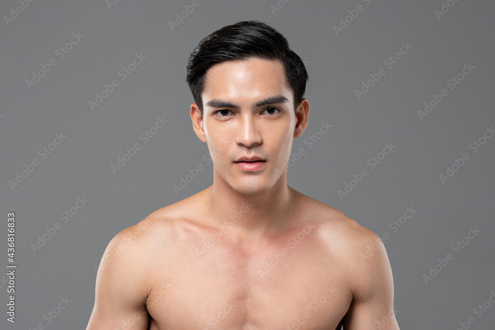Young shirtless handsome Southeast Asian man with healthy glowing clear ...