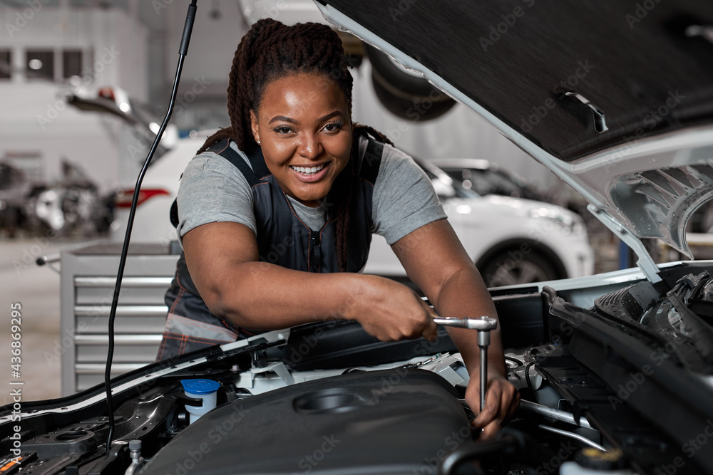 African Female Checks an Engine Breakdown. Car Service Employee Woman ...