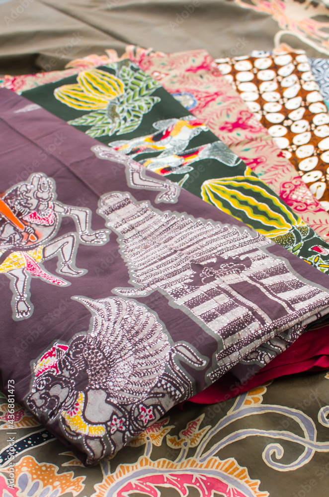 Batik is the art of painting cloth using wax and natural or artificial ...