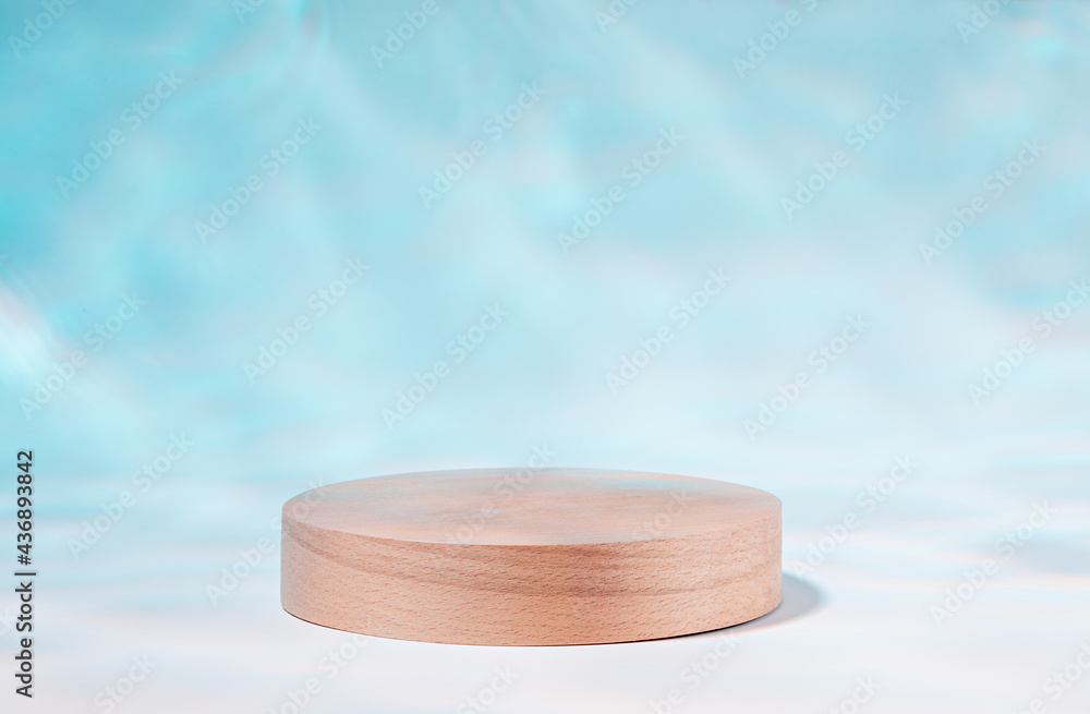 Wooden podium or product stand by swimming pool with reflection of ...
