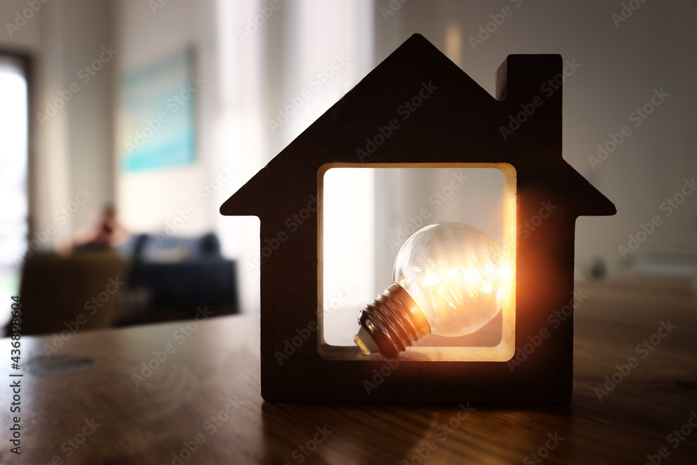 Wood house with Light bulb. energy concept or invention Stock Photo ...
