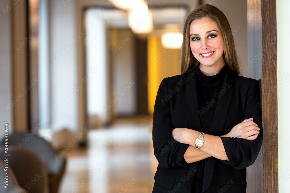 Beautiful blonde female business woman CEO in a suit at the office ...