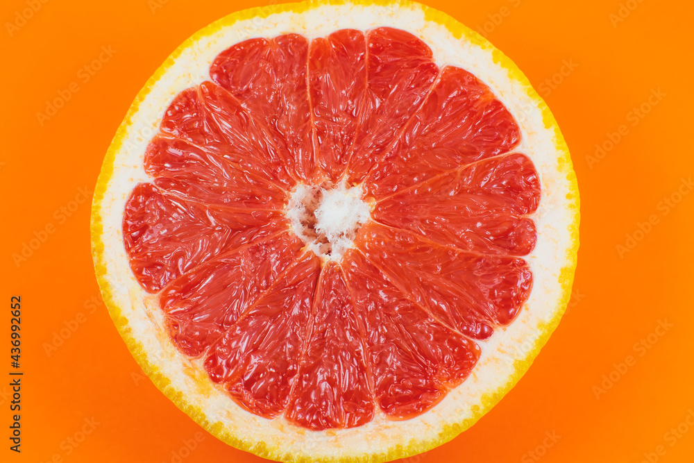 Grapefruit texture inside on the orange background. Citrus close up ...