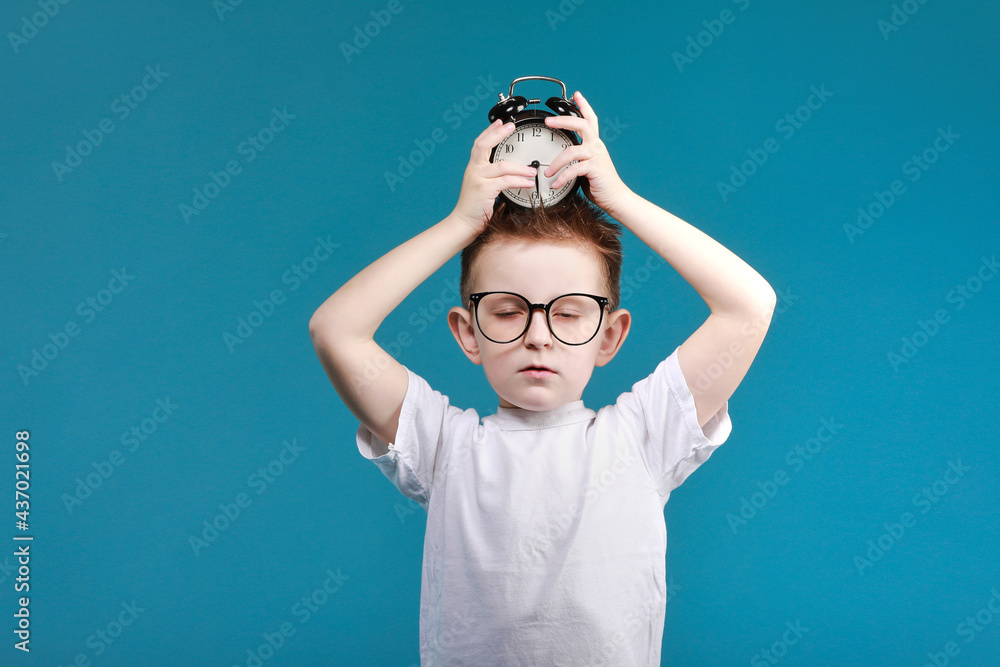 Time management. Morning. little boy with alarm clock. Happy childhood ...
