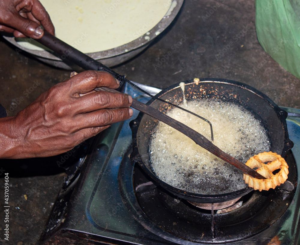 Village cooking; village girl cooking; frying sweets; traditional food ...