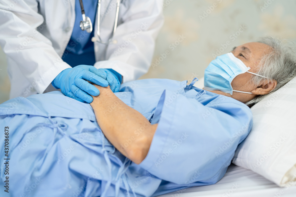 Asian doctor wearing face shield and PPE suit new normal to check ...