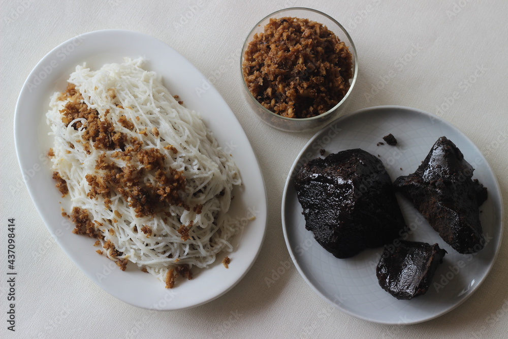 String hoppers, a steamed rice noodle dish with grated cocunut and palm ...
