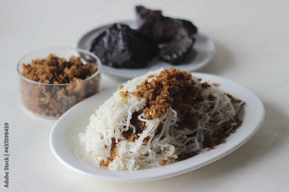 String hoppers, a steamed rice noodle dish with grated cocunut and palm ...