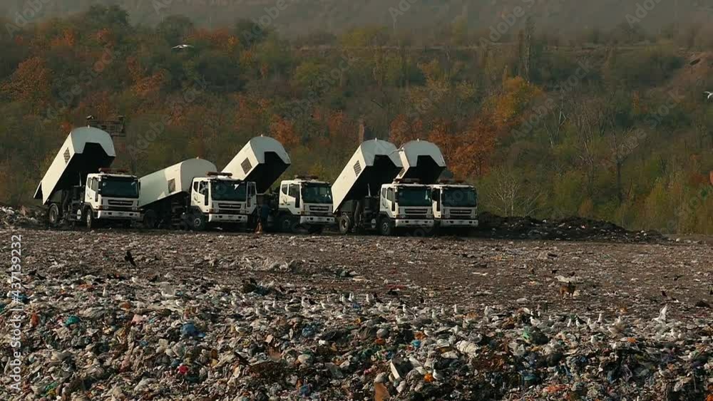 Dust collector machines unload dust at a landfill. Dust suppression ...