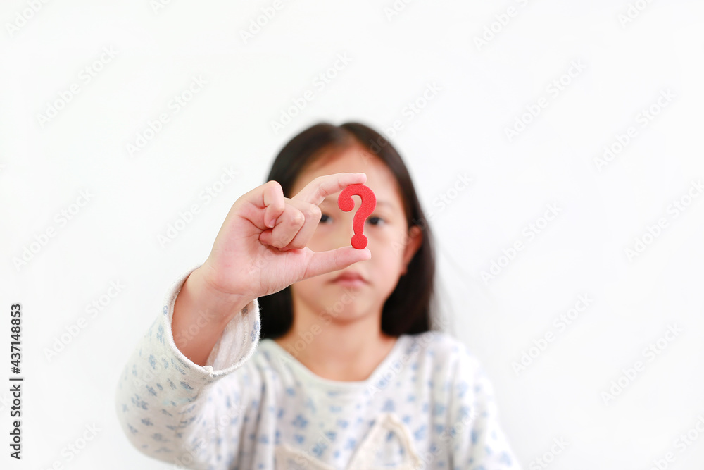 Asian little child girl holding red question mark sign over white ...